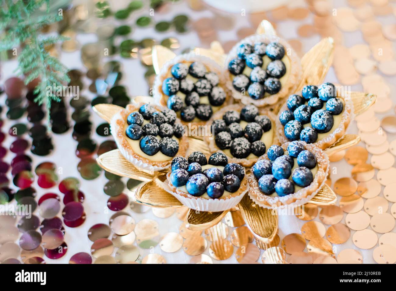 Fancy blueberry tarts at a party Stock Photo - Alamy