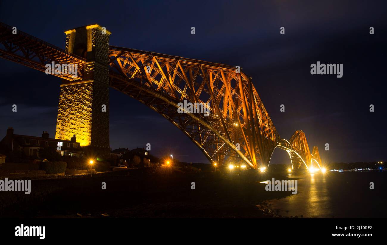 A view of Forth Bridge in Edinburgh, Scotland with a railway line ...