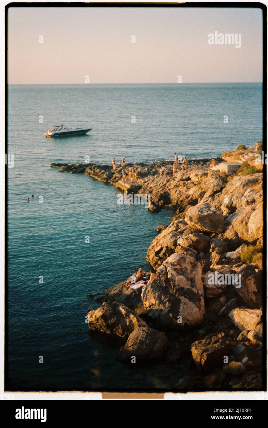 People enjoying summer life by the Mediterranean and the boat Stock ...