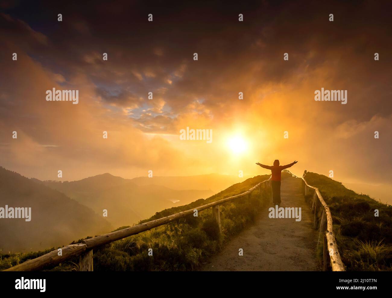 Woman enjoying the view the sunset the mountains hi-res stock ...