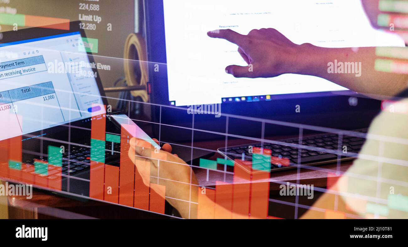 Close up shot of a man working on computer with blended image of the ...