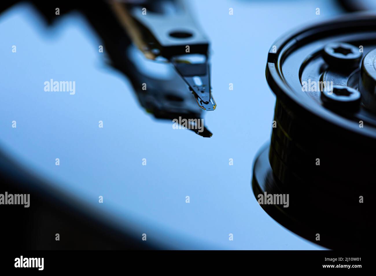 Macro Close up of inside of magnetic Hard Disc Drive with mirror ...