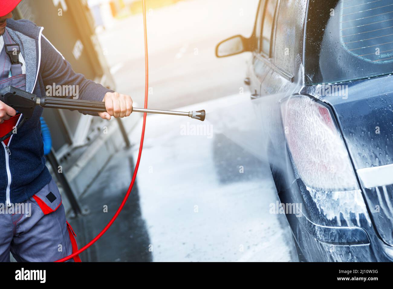 Car wash worker is washing client's car Stock Photo - Alamy