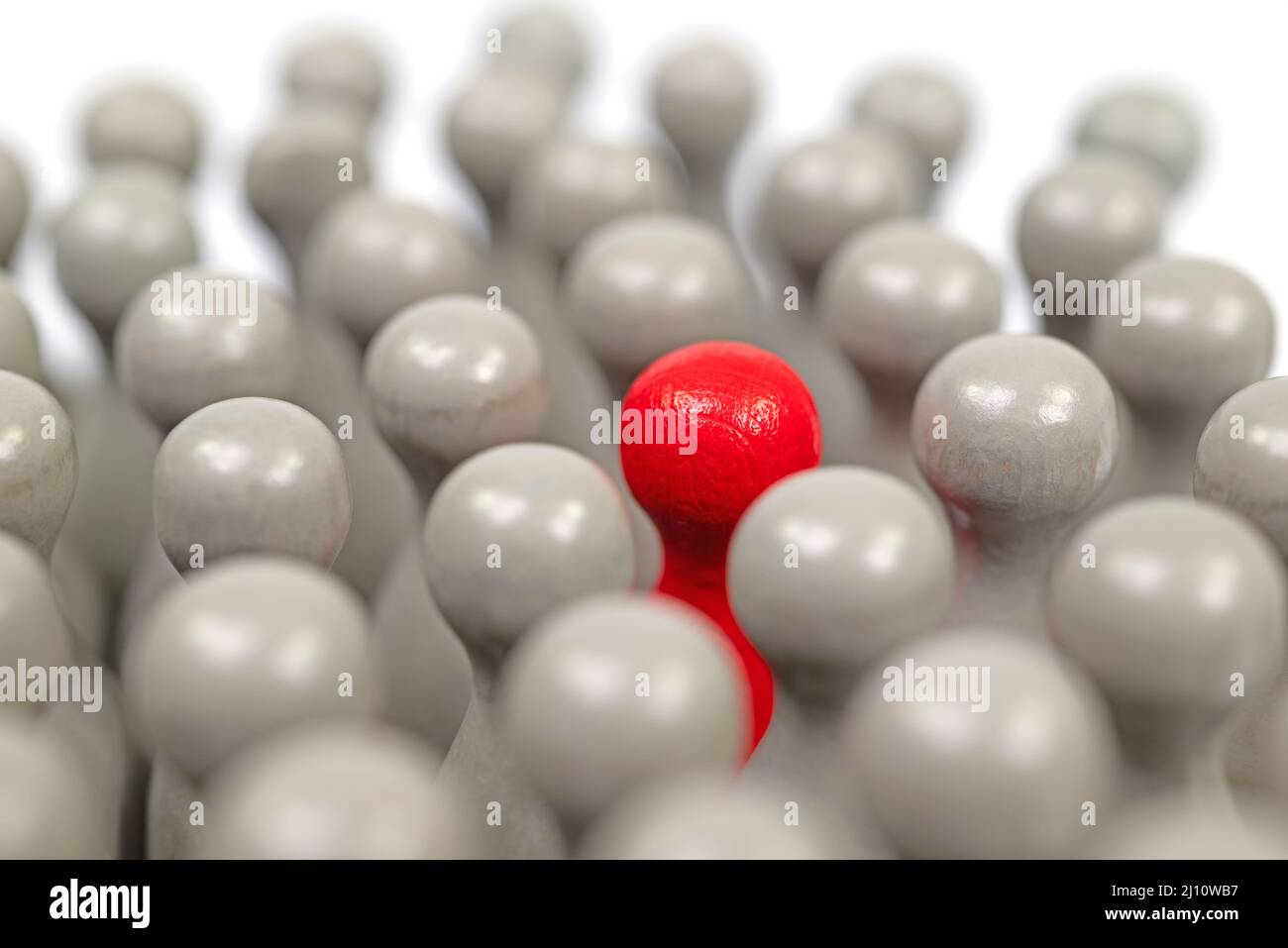 Outsider, conspicuous in the crowd Stock Photo - Alamy