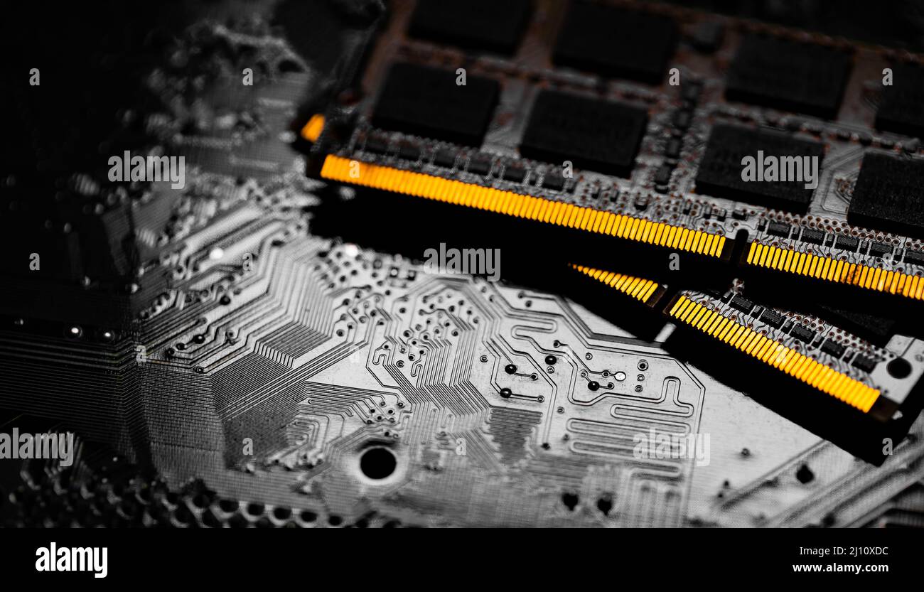 Macro Close up of computer RAM chip and motherboard on dark background ...