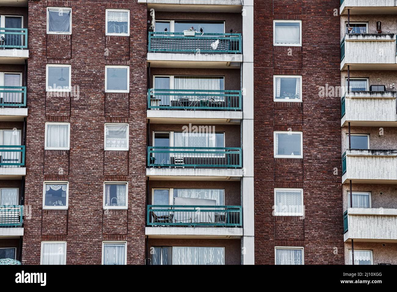 Residential brick building facade with balconies Stock Photo - Alamy