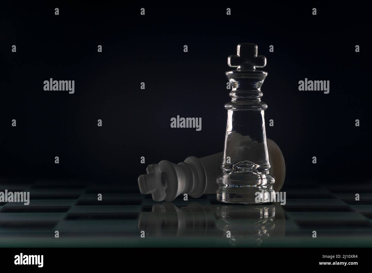 Fallen chess king as a metaphor for fall from power black background ...
