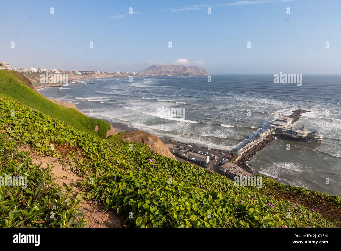 An aerial view of Miraflores grassy cliffs heading towards the Pacific ...