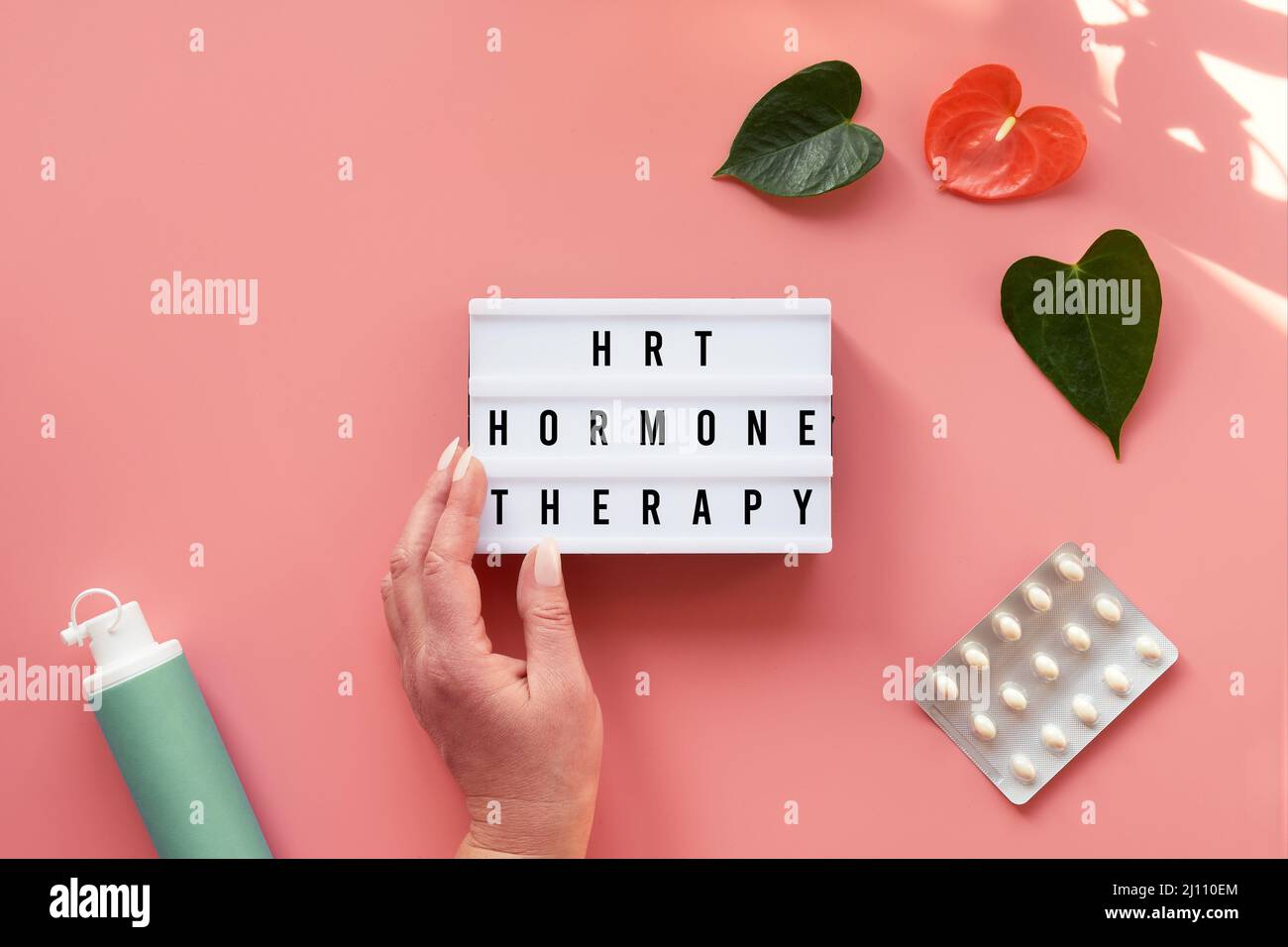 Text HRT Replacement Therapy on light box in hand. Menopause, hormone ...