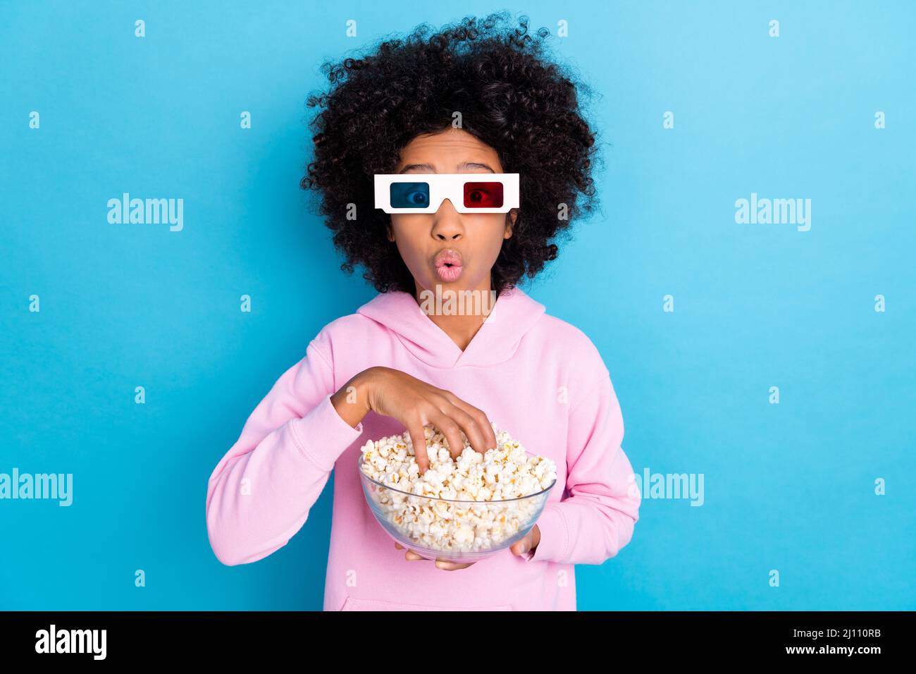 Photo of young impressed girl omg eat pop corn watch movie weekend ...