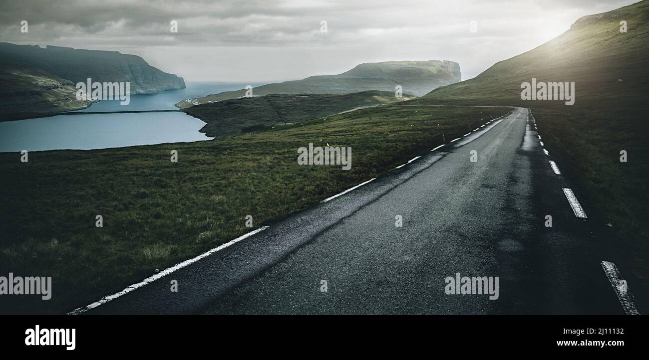 View of countryside road near sea during trip roaming the curvy roads ...