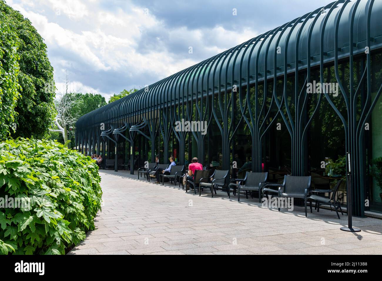 Nice sunny day in Washington DC, USA with people sitting on stools ...