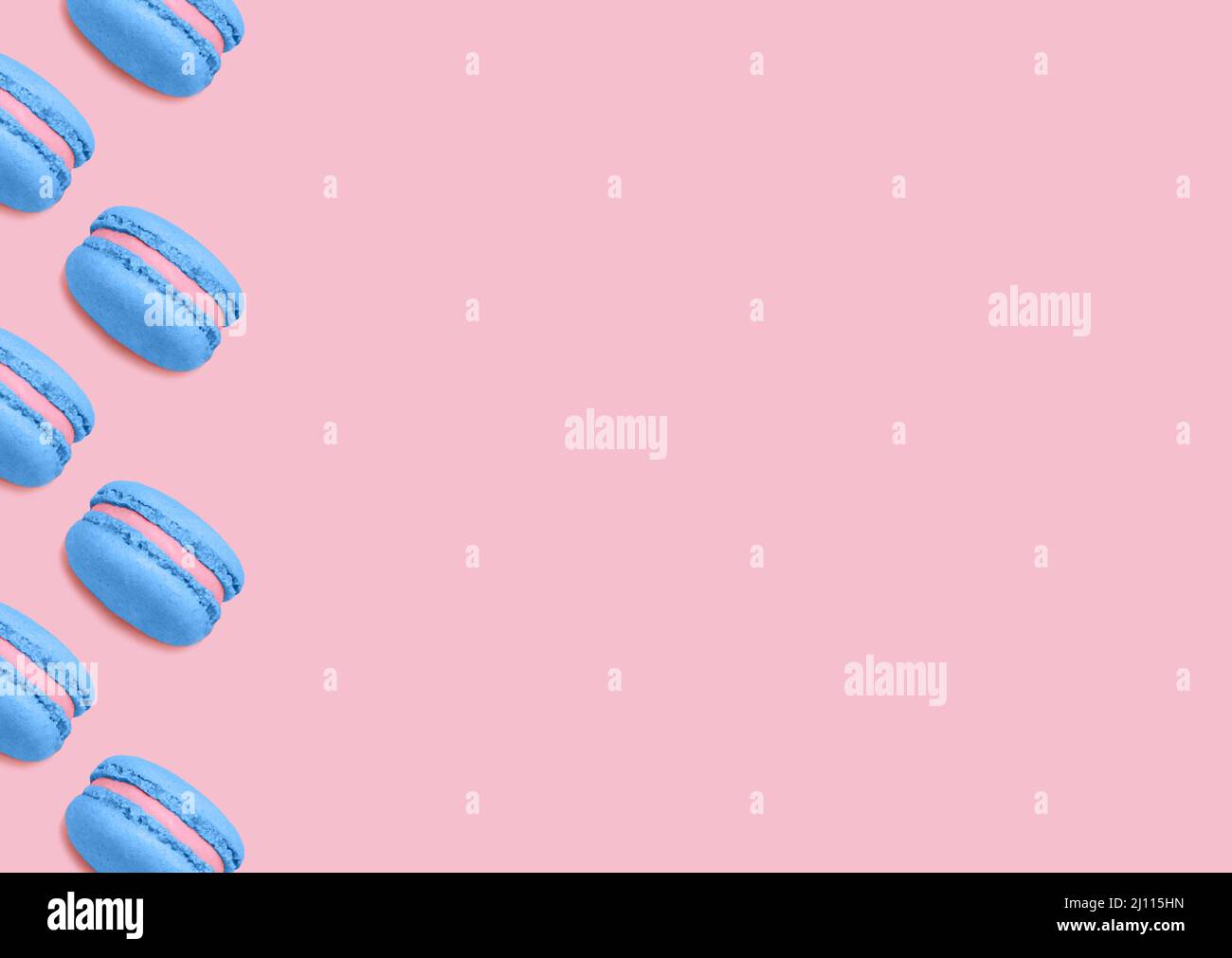 Blue biscuits with berry filling on pink background. Minimal style ...