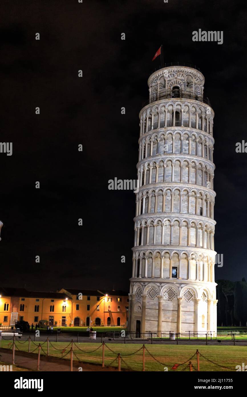 Vertical shot of Leaning Tower of Pisa against night sky in Piazza del ...