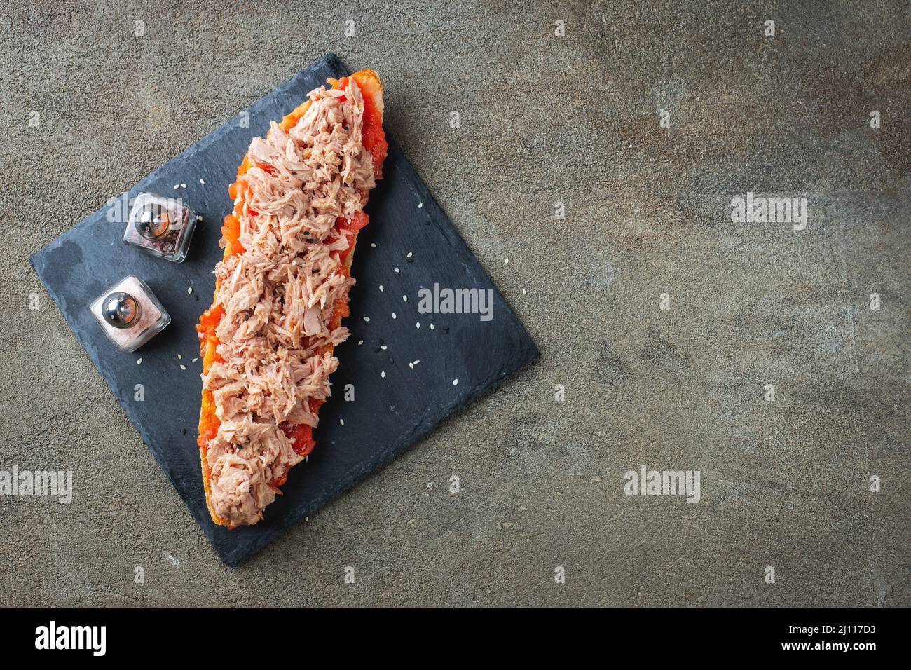 Traditional Spanish breakfast. Tostada with different toppings on a ...