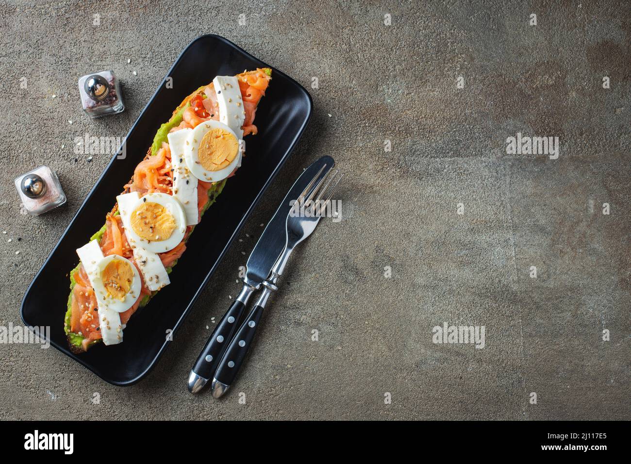 Traditional Spanish breakfast. Tostada with different toppings on a ...