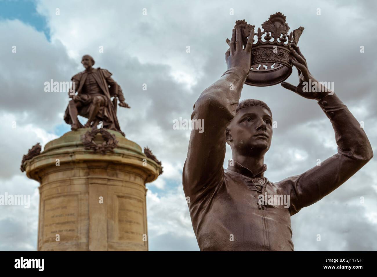 A statue of William Shakespeare's Prince Hal lifts a crown above his ...
