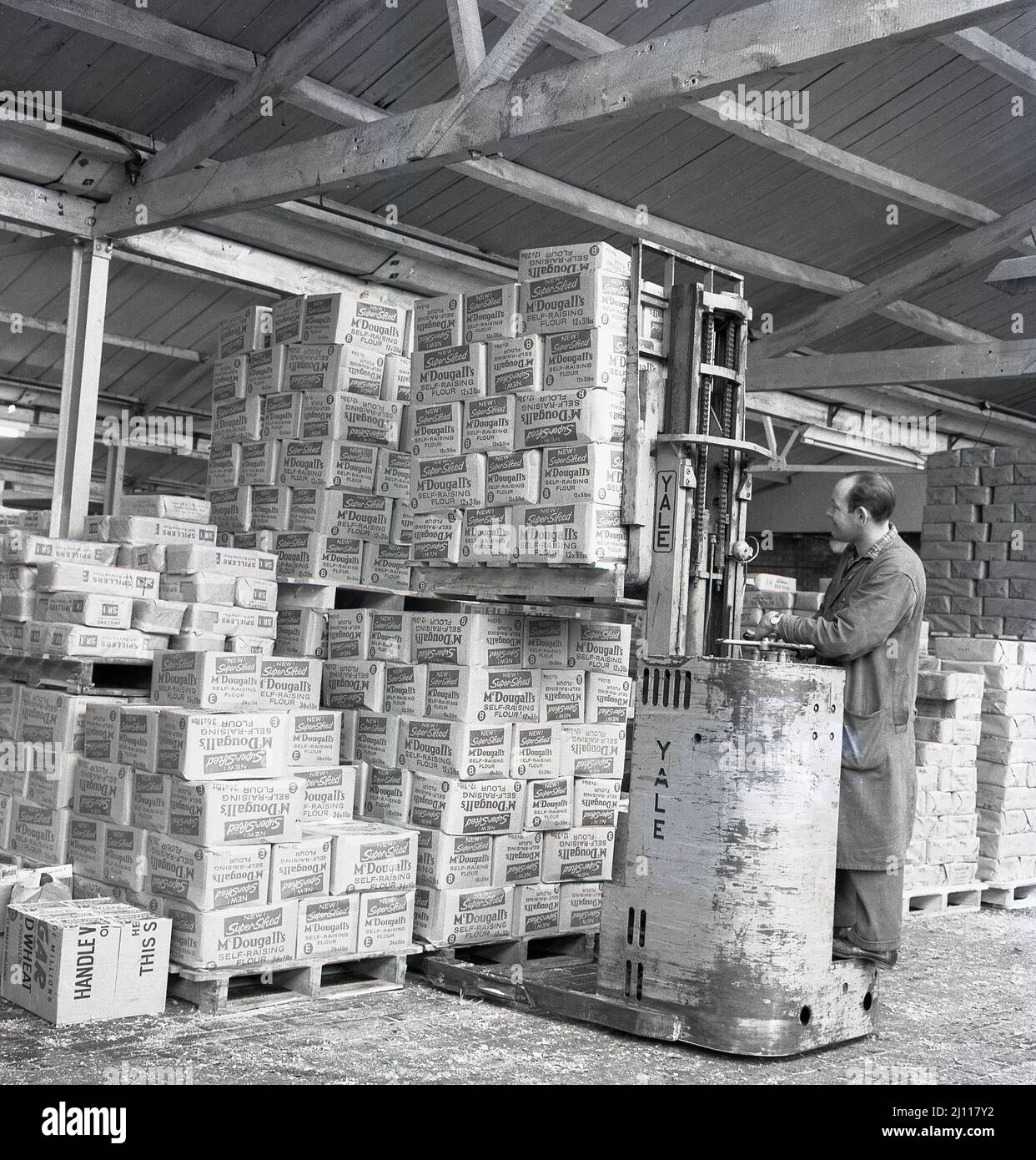 1950s, historical, at a section of the warehouse of leading Oxford ...