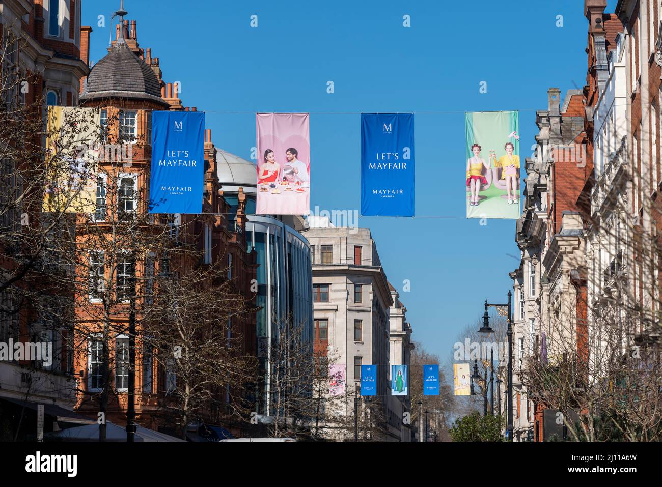Let's Mayfair promotional banner flags hanging above a street in ...