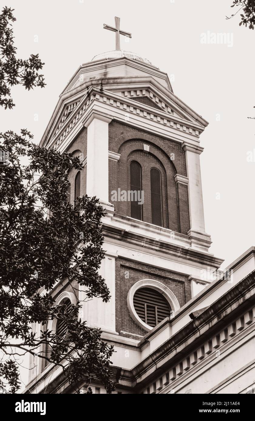 Low angle of a church tower against the sky in monochrome colors Stock ...