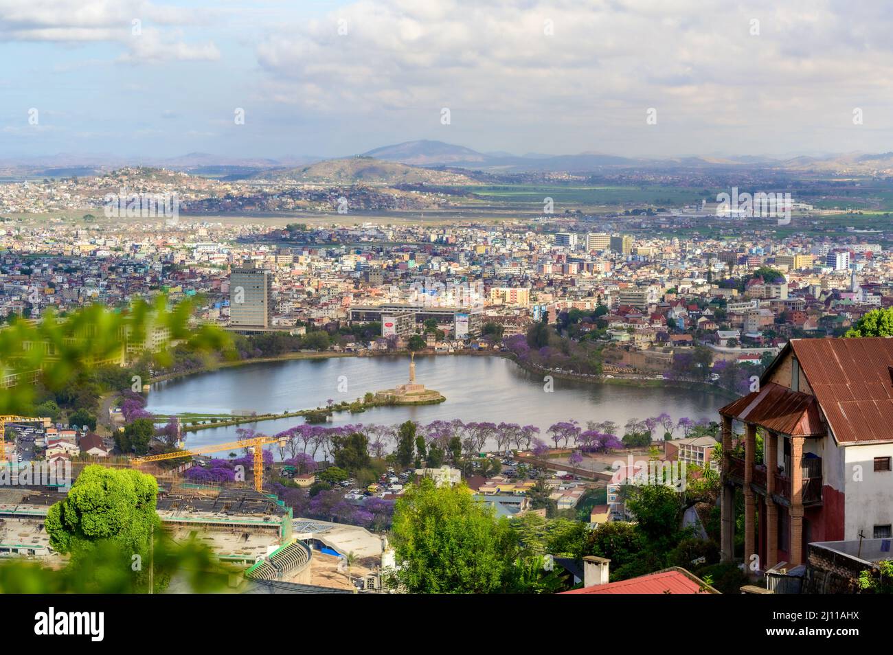 Aerial view of lake Anosy and the skyline of the city of Antananarivo ...