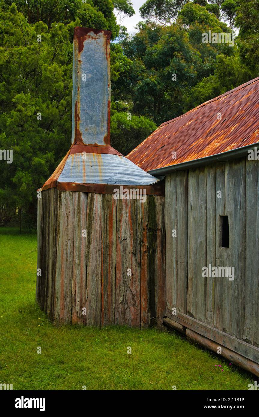 Chimney of an abandoned traditional wooden pioneer house in the forest ...