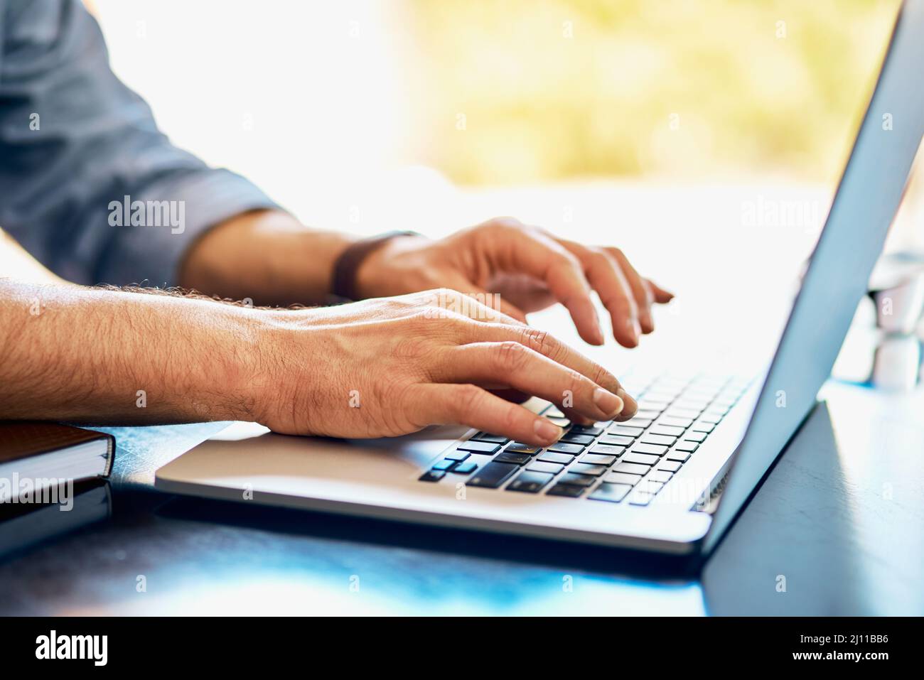 Typing out his stream of ideas. Closeup shot of an unrecognizable man ...