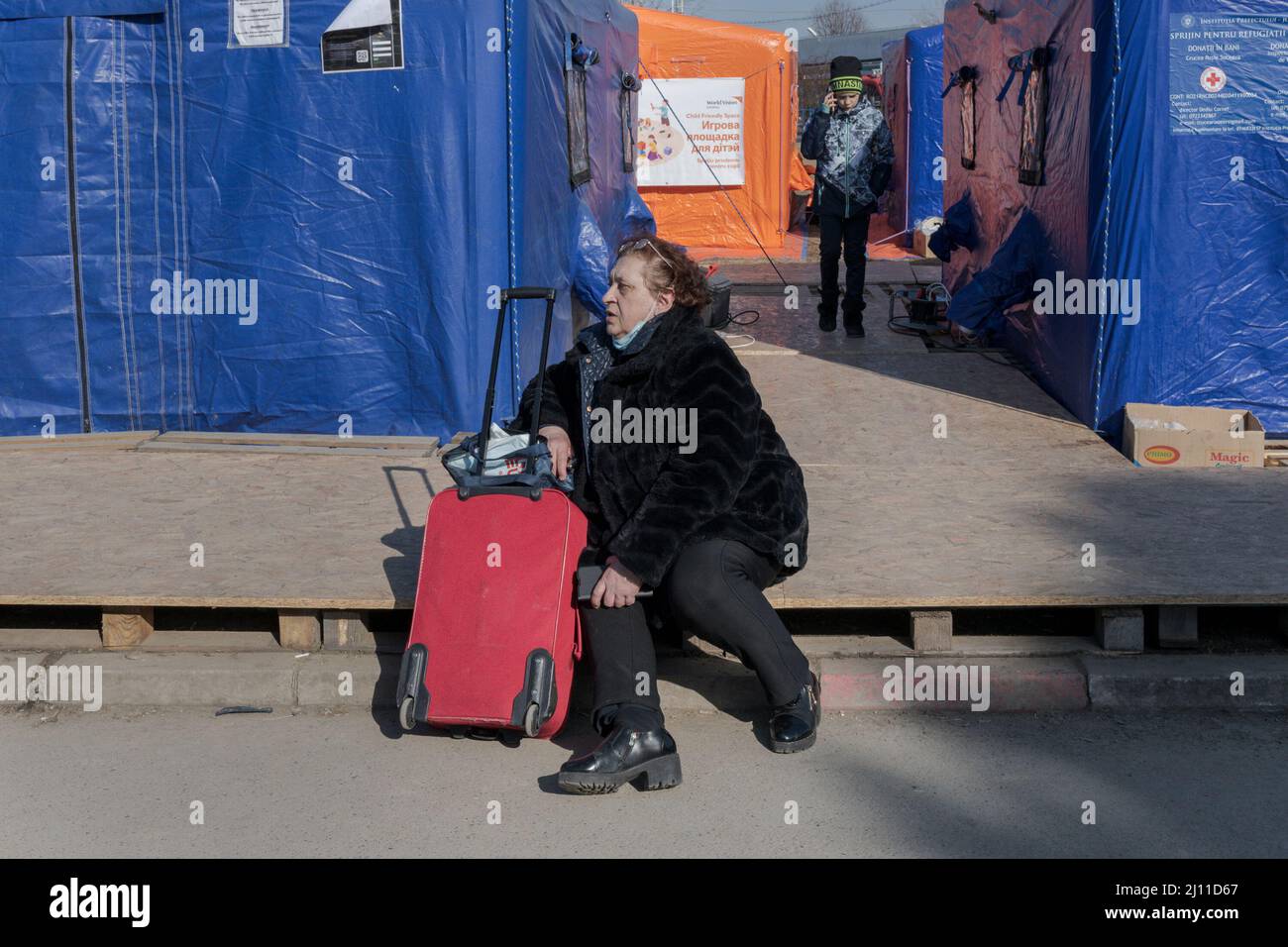 Siret, Romania. 18th Mar, 2022. A tired and confused woman takes a ...
