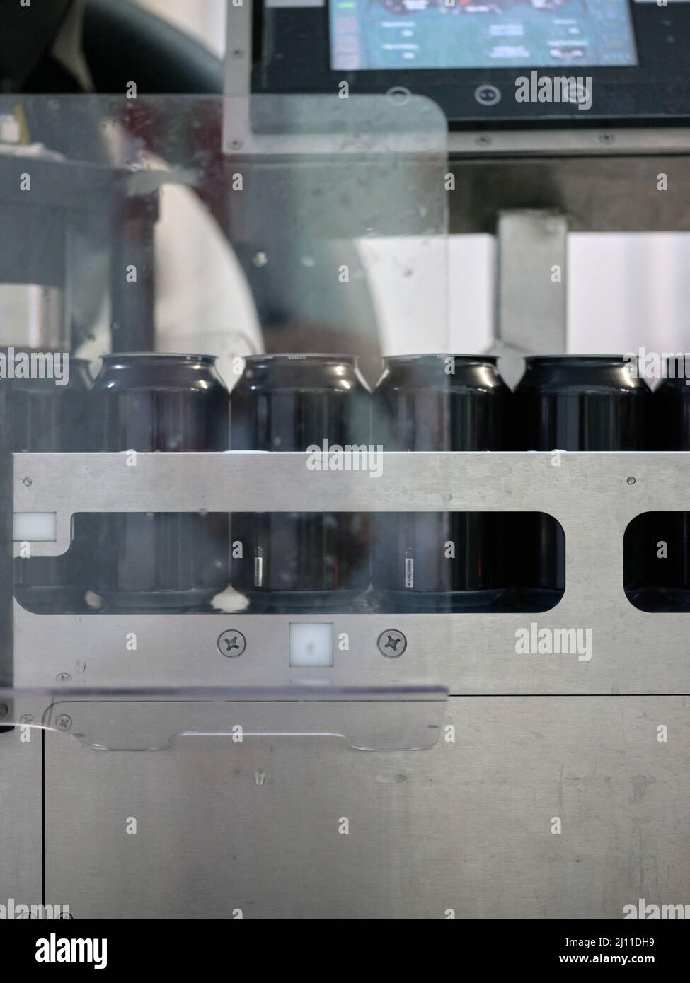 Beer cans on a platform on the packaging line of a brewery Stock Photo ...