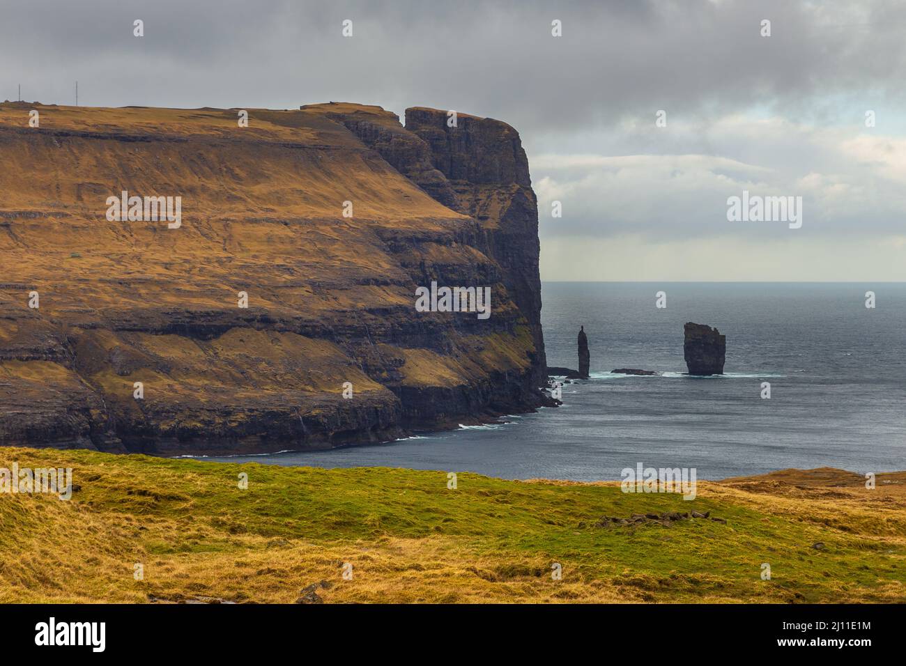 Risin og Kellingin rock formations on the coast of Eysturoy Island ...