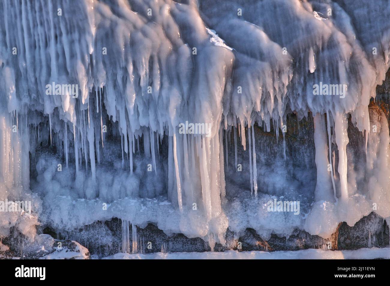 Beautiful winter background with frozen water jets Stock Photo - Alamy