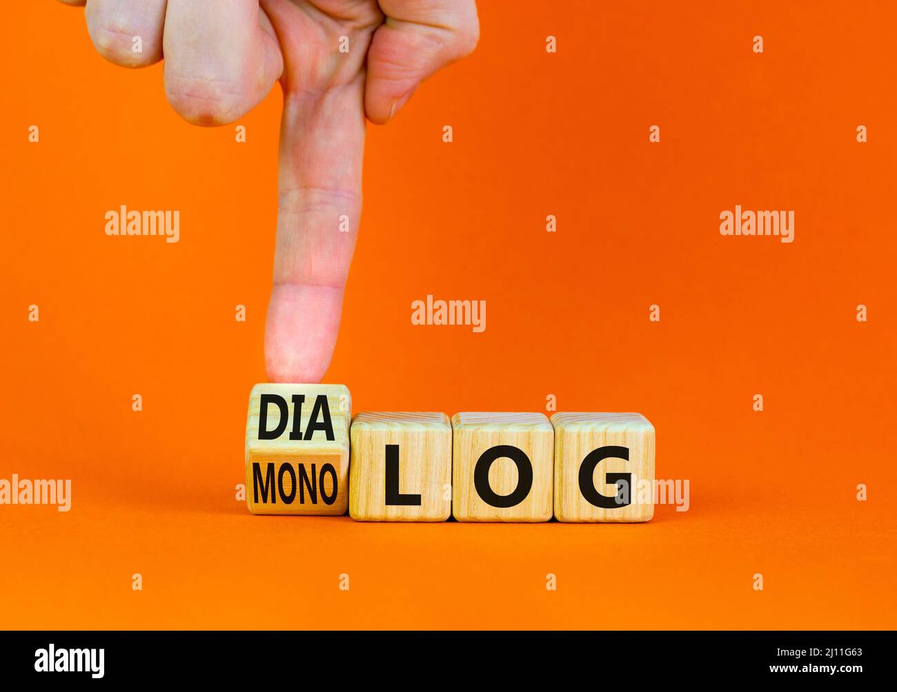 Businessman turns wooden cubes and changes the German word monolog ...
