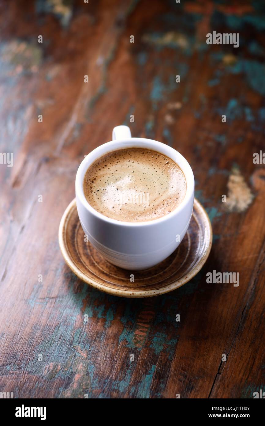 Cup of coffee on rustic wooden background Stock Photo - Alamy