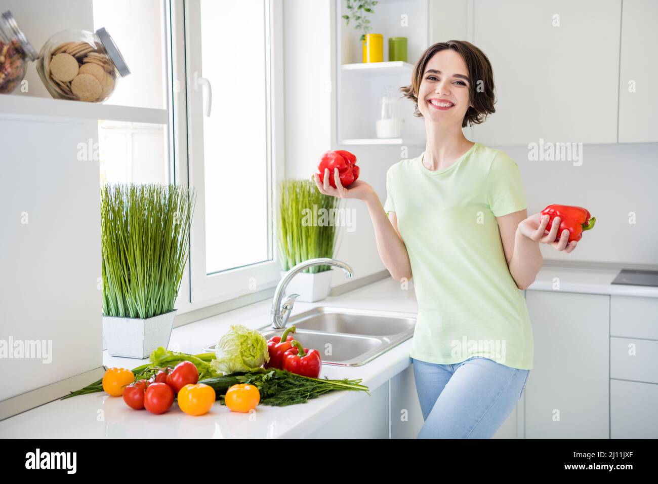 Photo of cheerful pretty lady arms hold red paprika toothy smile good ...