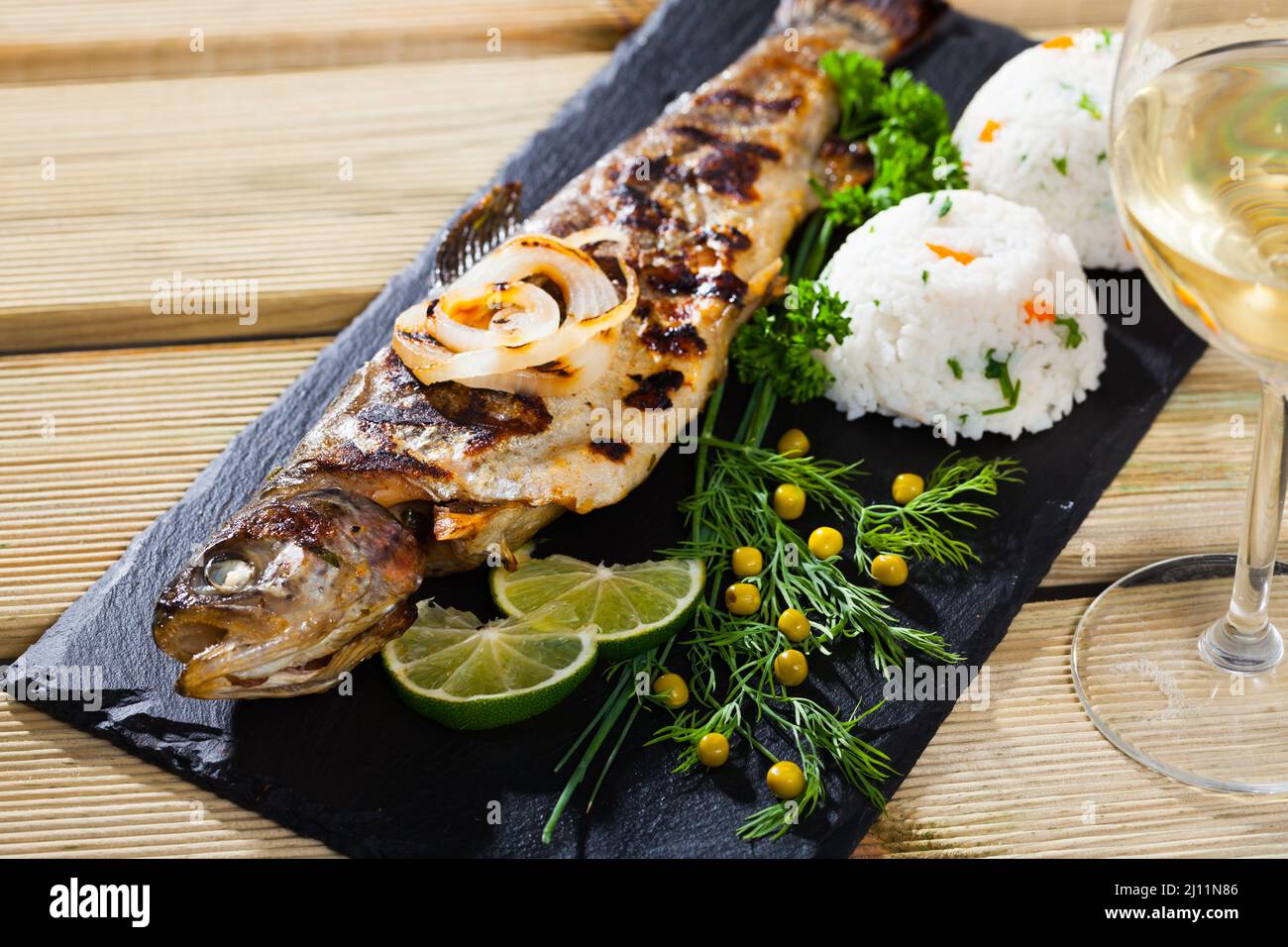 Grilled trout with rice Stock Photo - Alamy