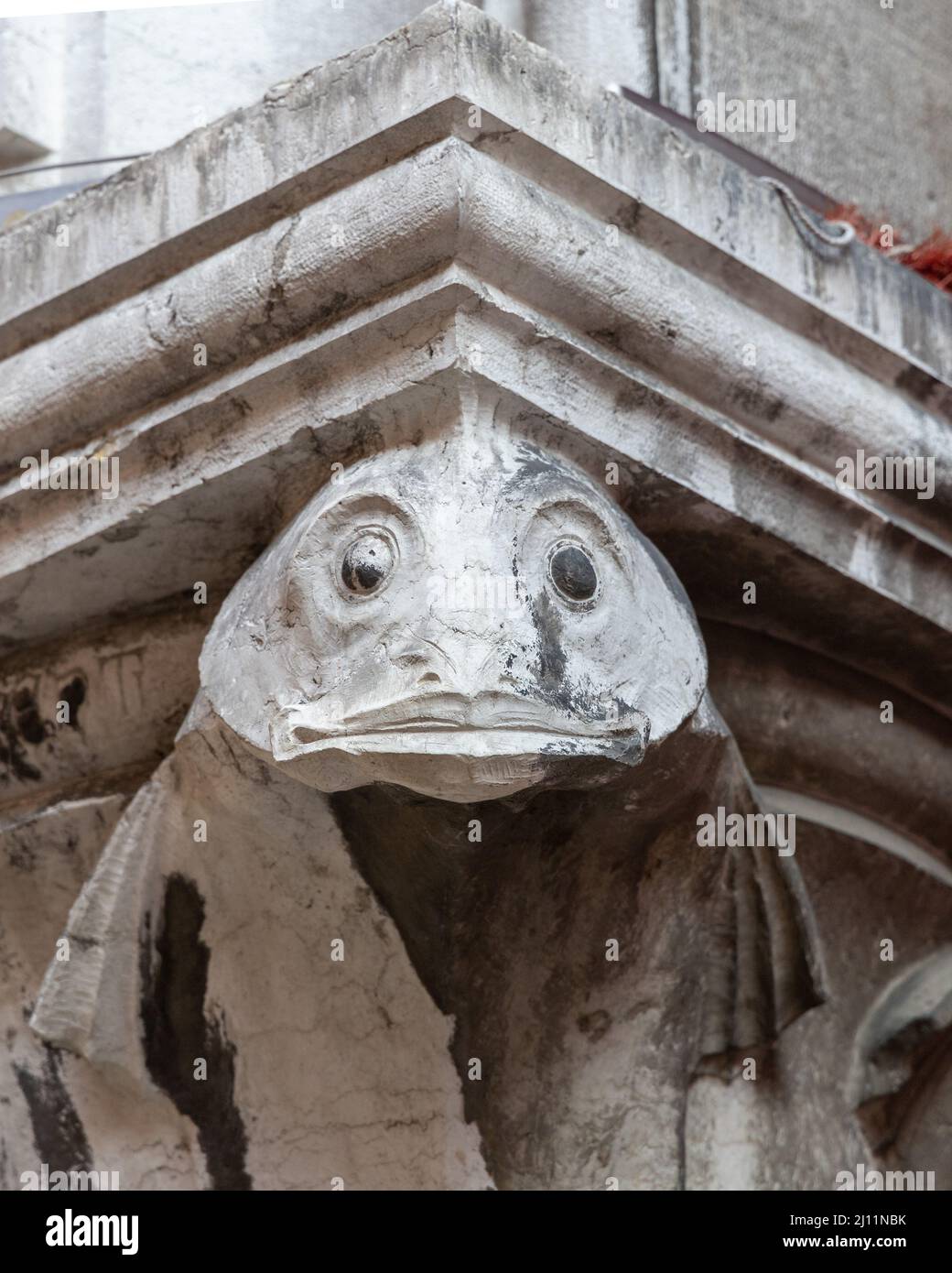 Closeup of a fish gargoyle on the pillar at the Rialto fish market in ...