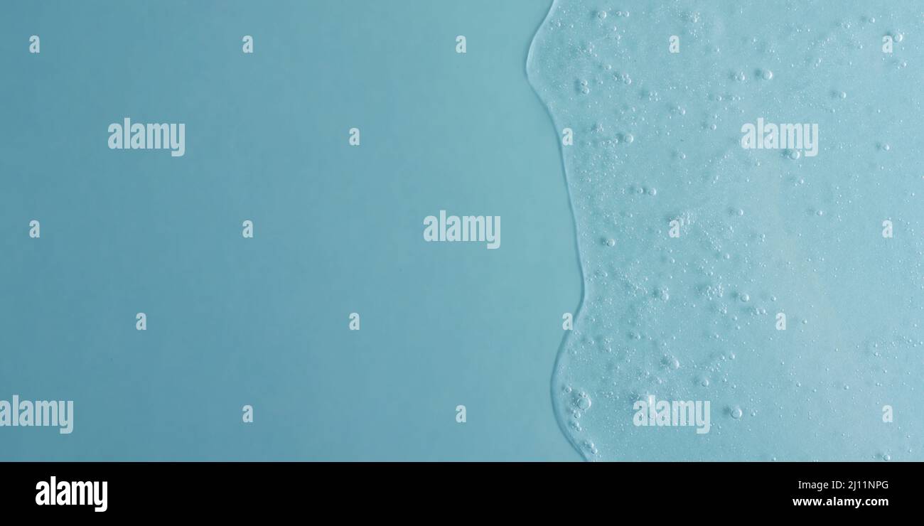 Background from cosmetic gel with bubbles,dripping down.Top view ...