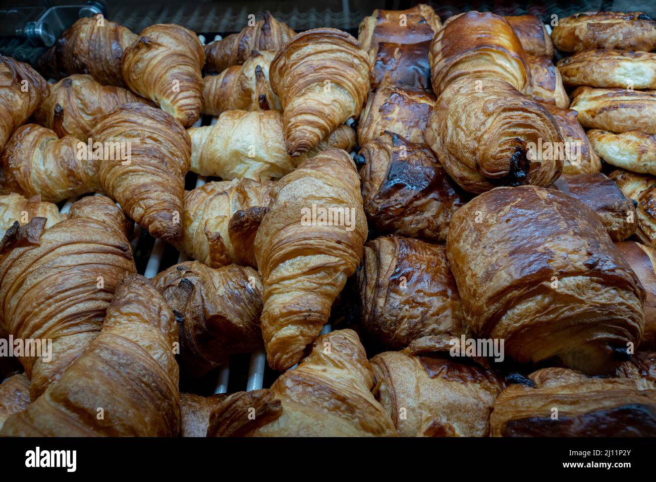 Artisan baker and pastry chef. Detail of mixed pastries in a bakery ...