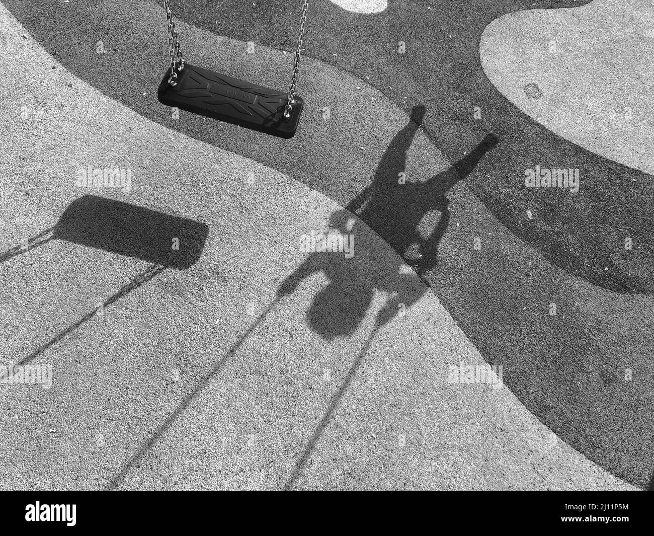 Shot of a shadow of a child swing Stock Photo - Alamy