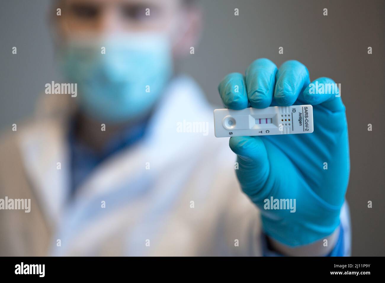 Express corona test. Positive covid antigen test Stock Photo - Alamy