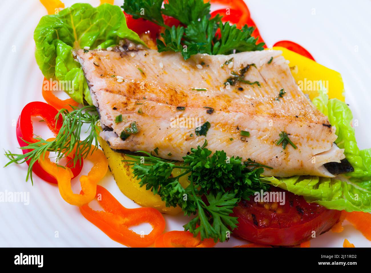 Fried trout fillets with vegetables Stock Photo - Alamy