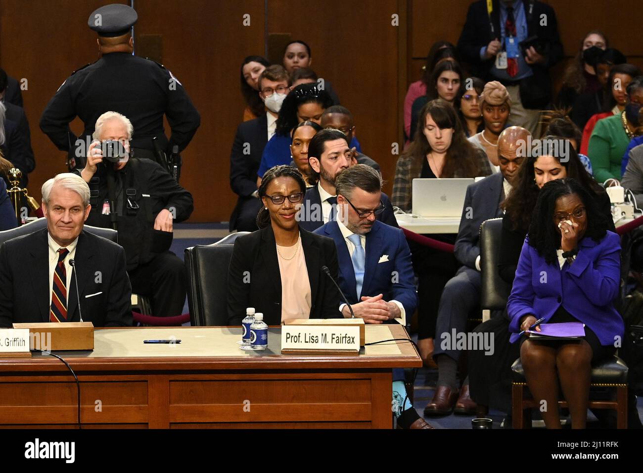 Judge Ketanji Brown Jackson (R) wipes a tear while being introduced by ...