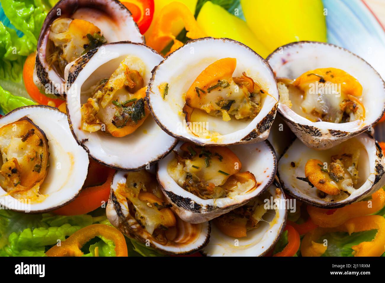Baked in oven bivalve shellfishes Stock Photo - Alamy