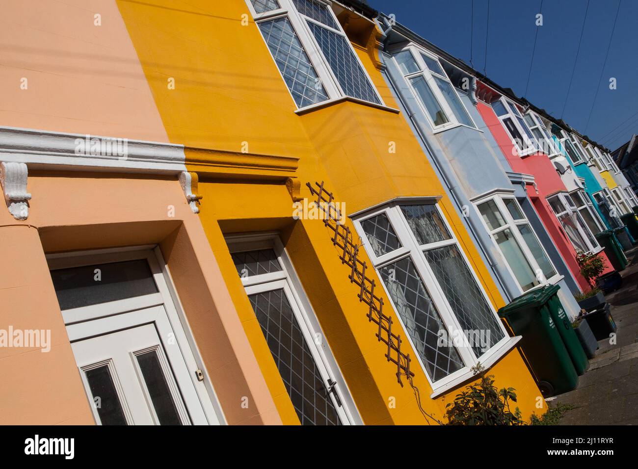 A terrace of brightly painted houses in Brighton, UK Stock Photo - Alamy