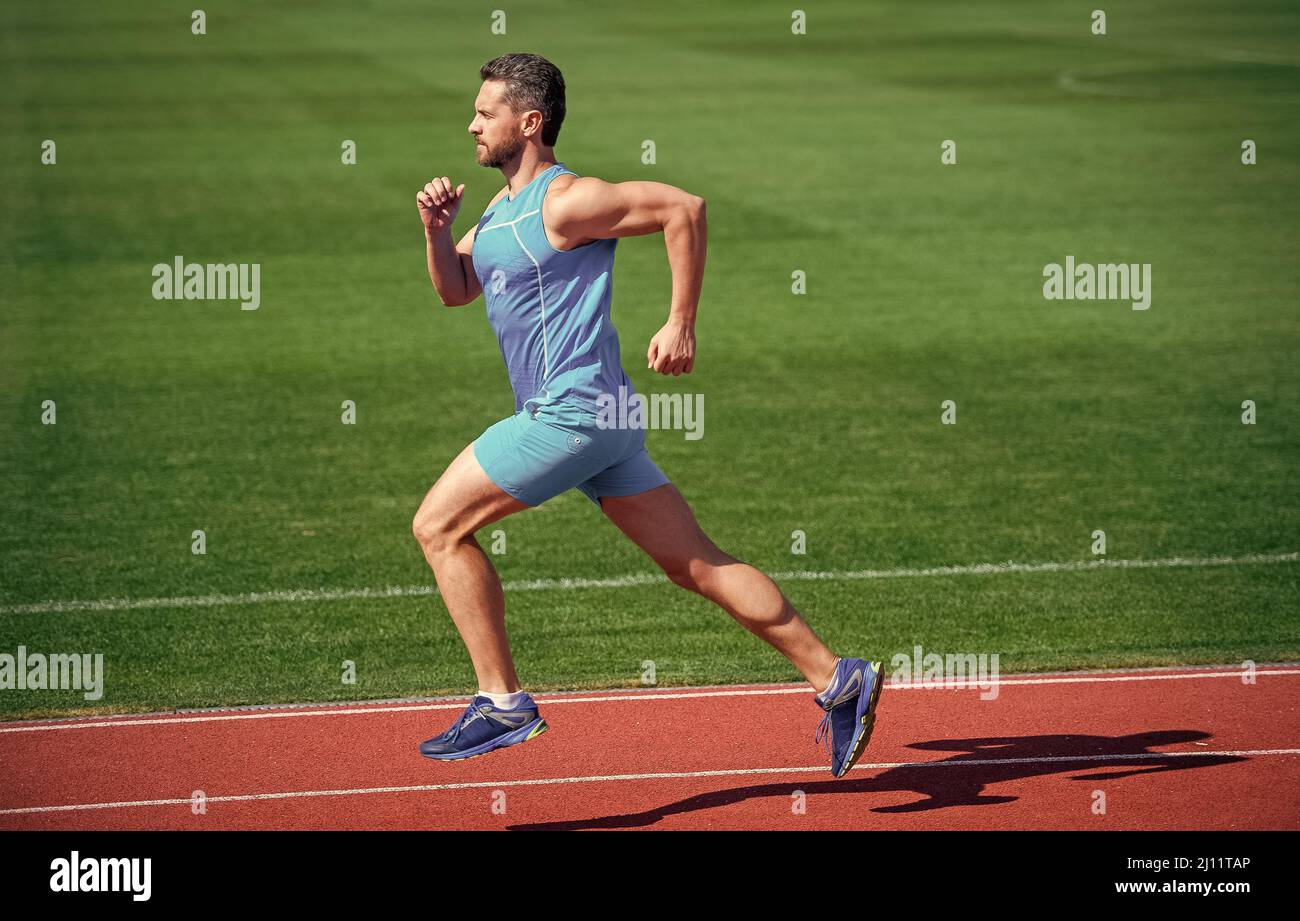 Athletic mature man running on stadium, speed Stock Photo - Alamy