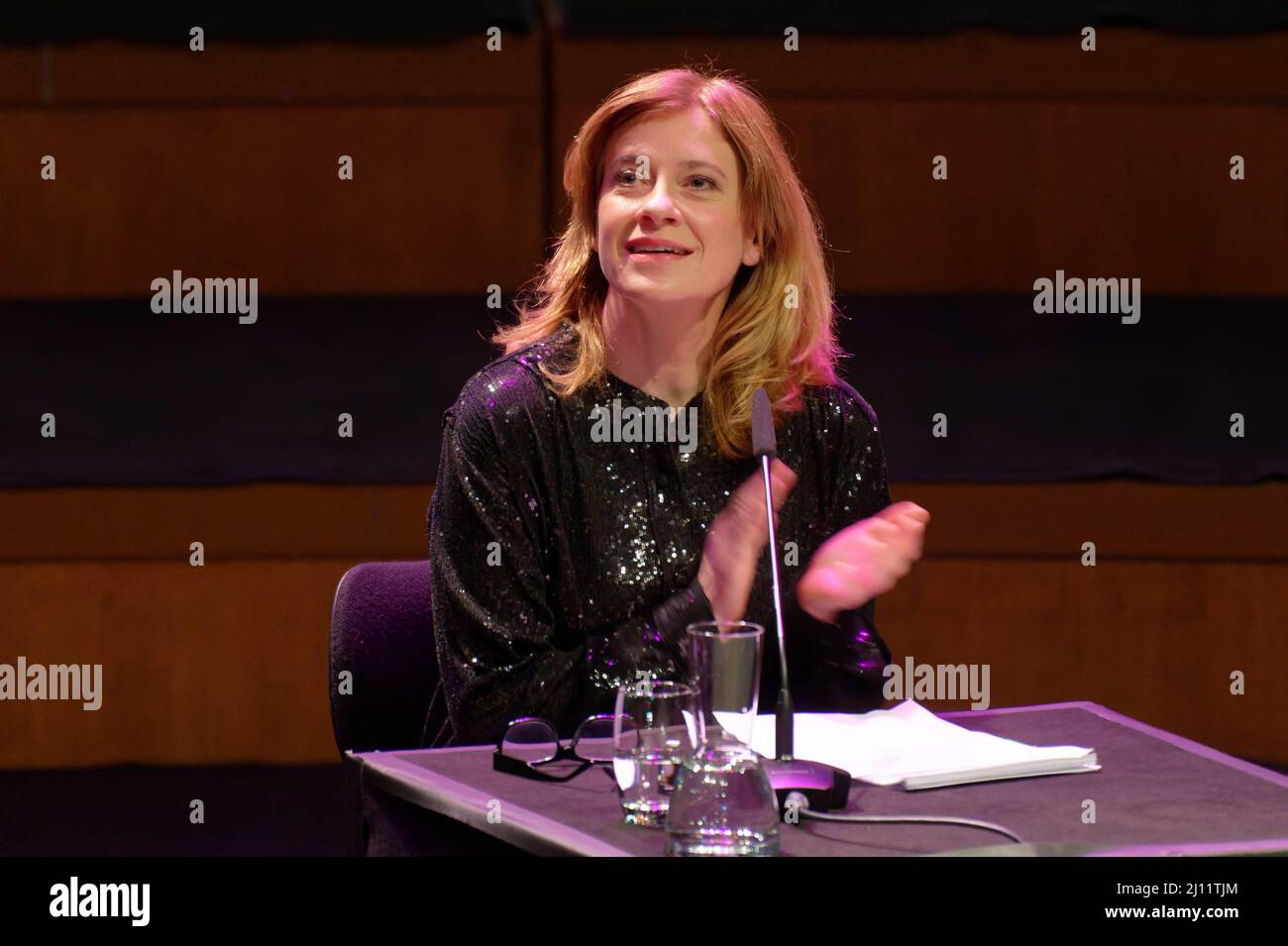 Cologne, Germany. 21st Mar, 2022. Actress Caroline Peters sits on stage ...