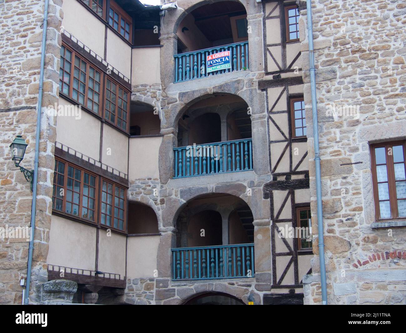 Outdoor view of an old brick-walled building in Saint-Etienne, Loire ...