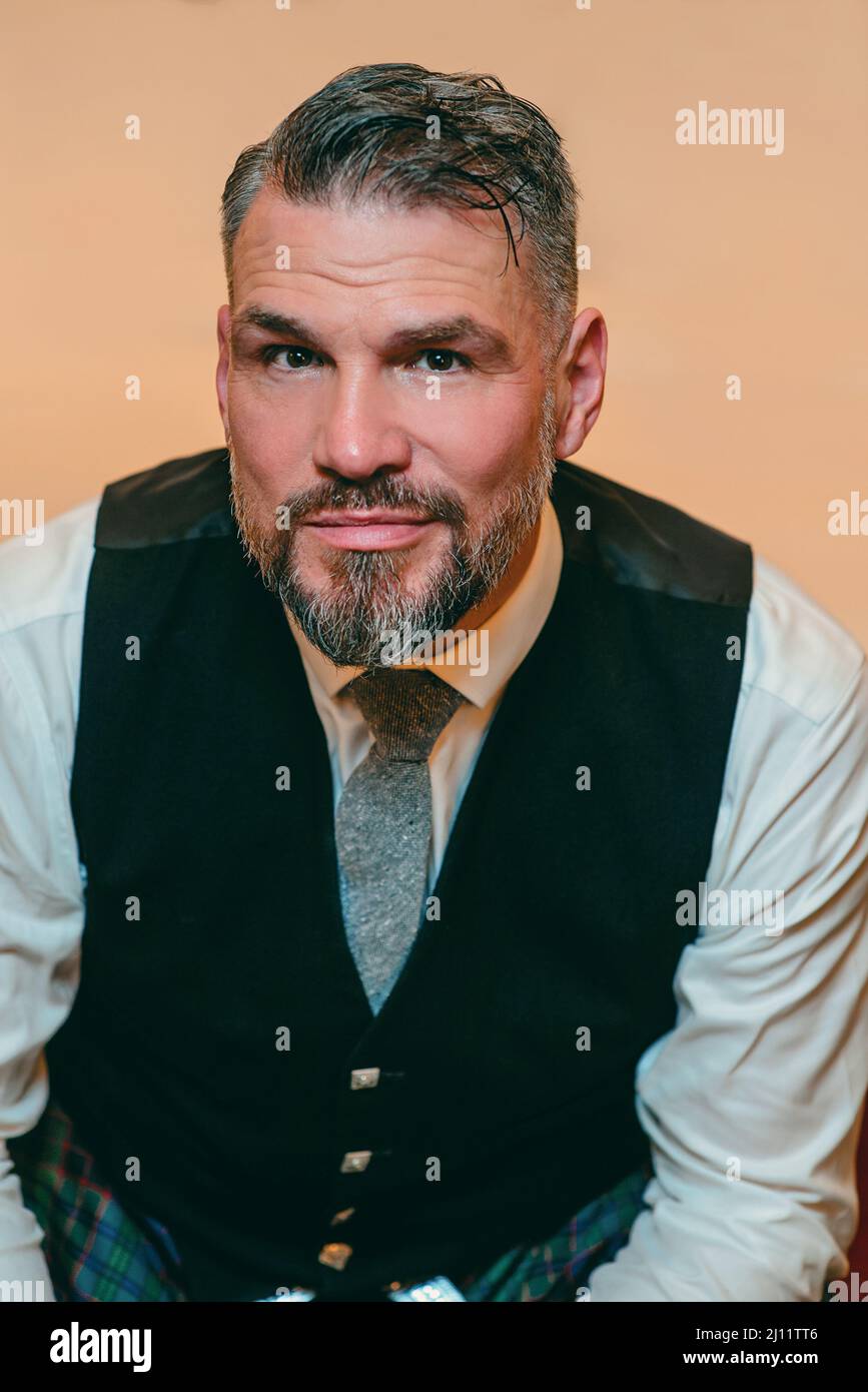 handsome mature courageous stylish man scotsman in kilt in fancy hotel ...