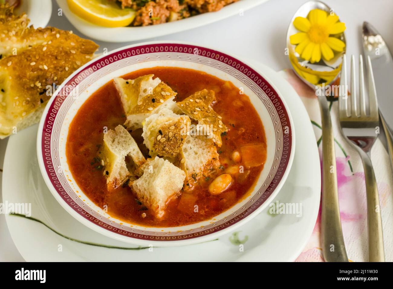 Traditional Turkish Ramadan iftar table with chopped Ramadan Bread into ...