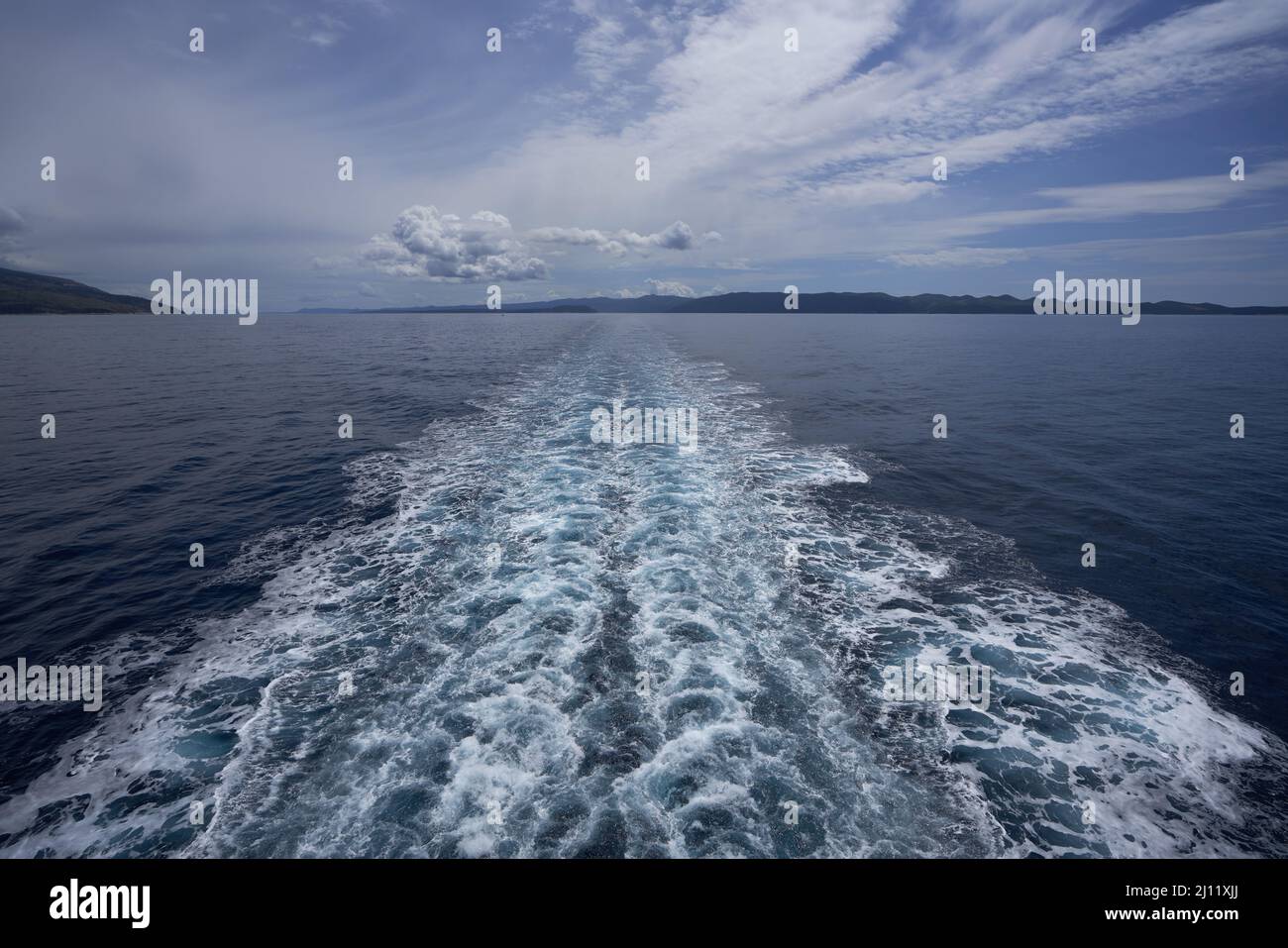 Wake of a ship trail, on sea with cloudy sky, moving, travel, going ...
